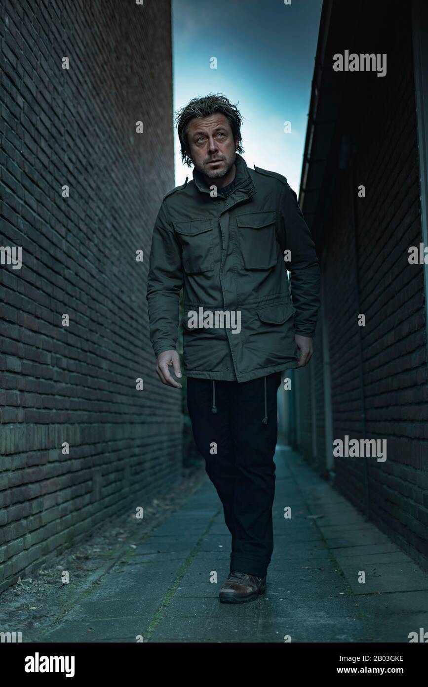 Suspicious man in street hi-res stock photography and images - Alamy