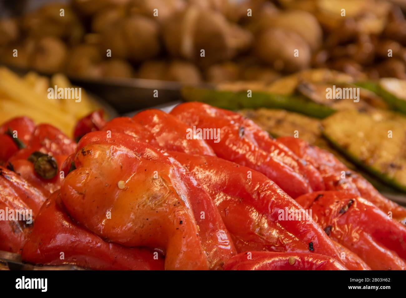 Baked slices of red pepper, cooked on the grill, street food closeup ...