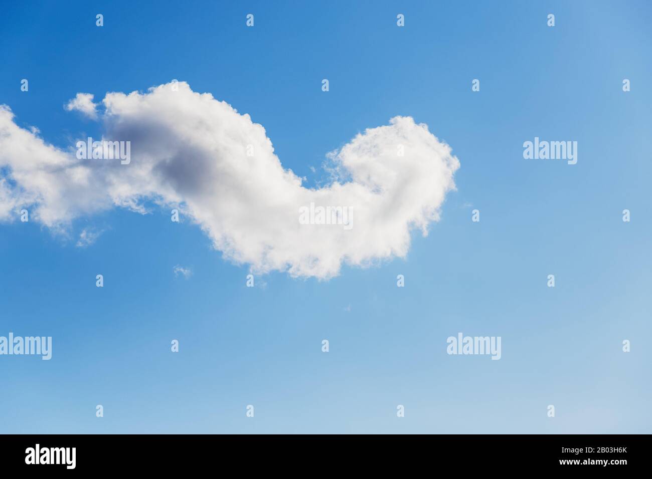 Blue gradient clear sky and big white curved cloud Stock Photo - Alamy