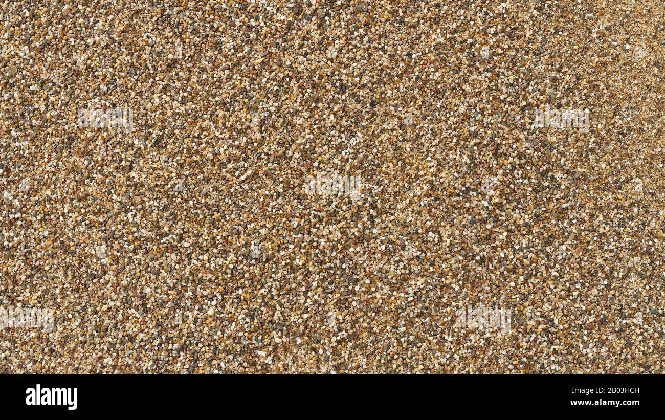 Close up of sand on a beach. Natural texture background Stock Photo - Alamy