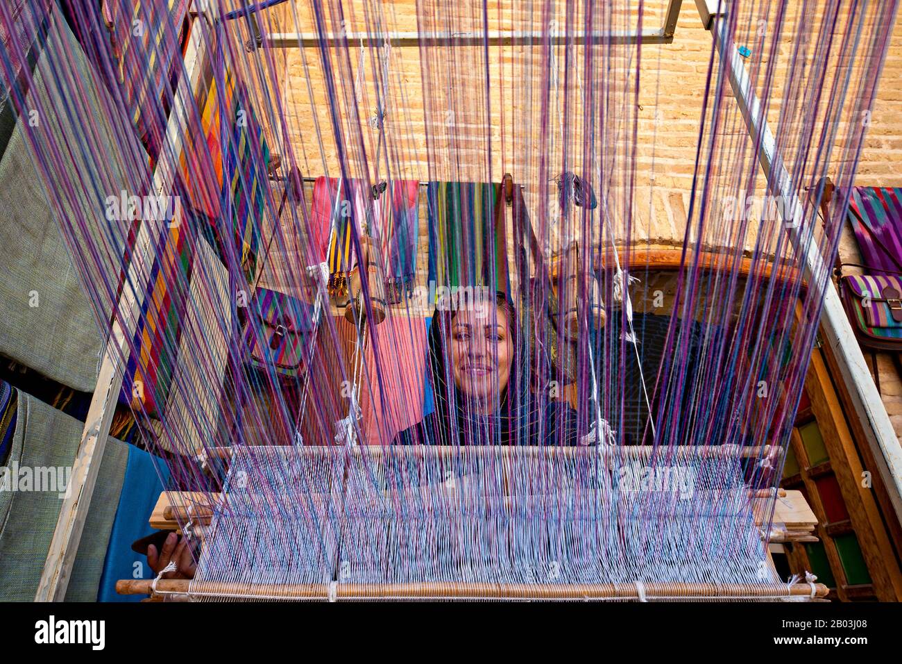 Iranian woman weaving fabric with traditional way, in Meybod, Iran ...