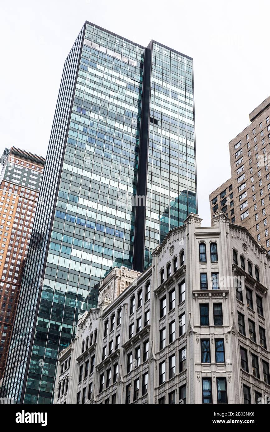 Low angle shot of modern skyscrapers and old classic buildings in ...