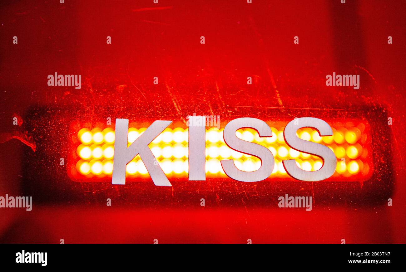 KISS letters illuminated on a back lit red neon light Stock Photo - Alamy