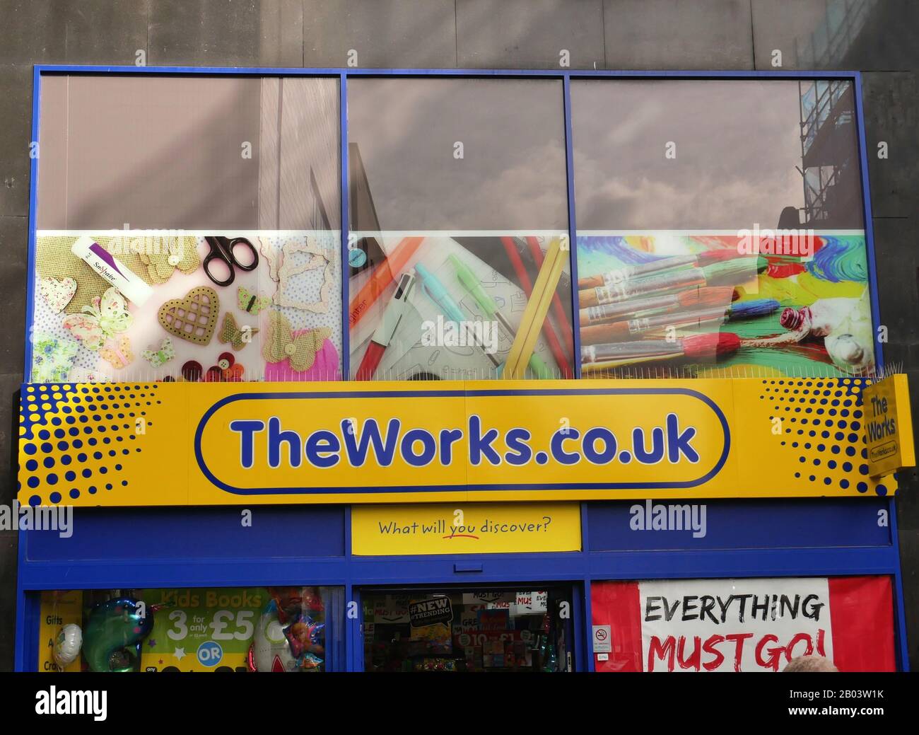 The works.co.uk shop front sign in yellow with blue writing and blue ...