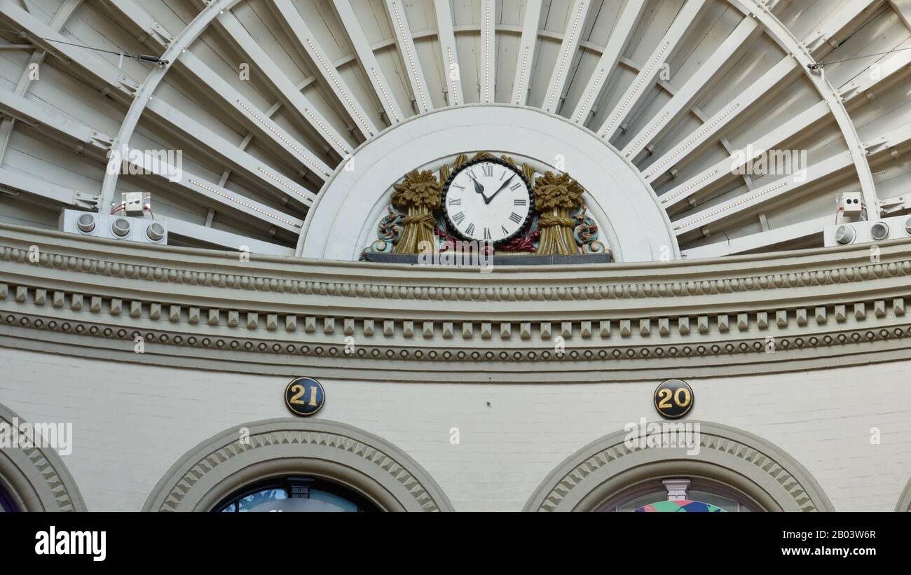 The ornate clock in the roof of the Corn Exchange Leeds with guilded ...
