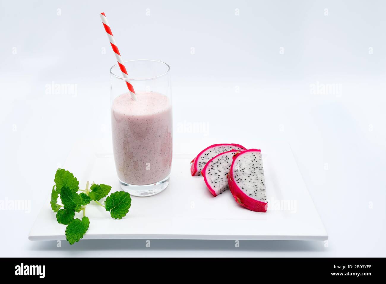 a dragon fruit / kite fruit smoothie on a white porcelain plate with ...