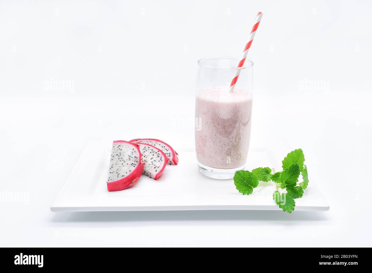 a dragon fruit / kite fruit smoothie on a white porcelain plate with ...