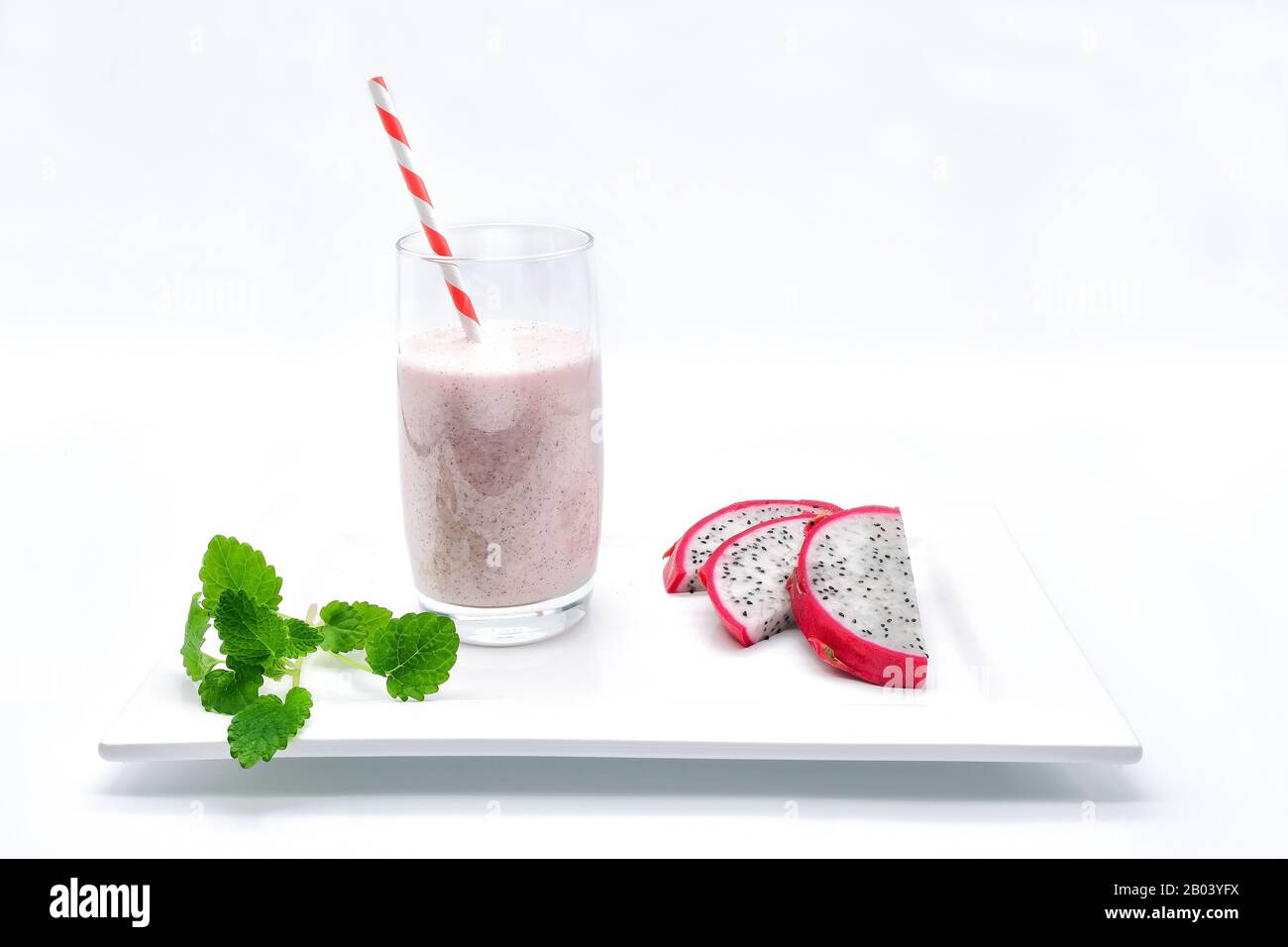 a dragon fruit / kite fruit smoothie on a white porcelain plate with ...