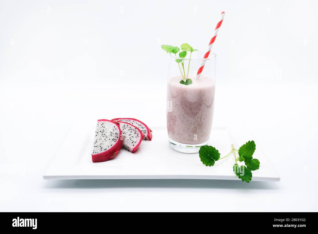 a dragon fruit / kite fruit smoothie on a white porcelain plate with ...