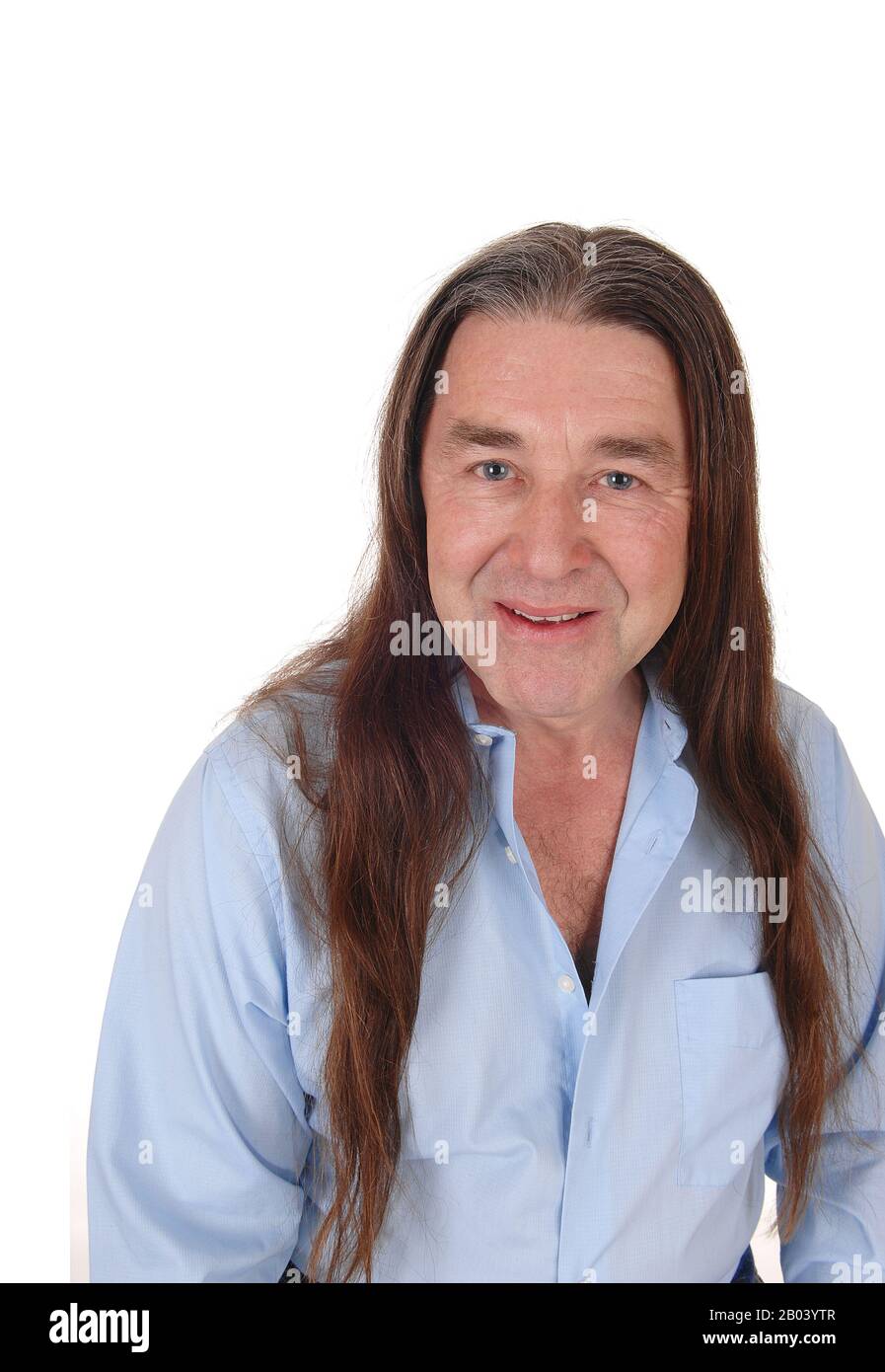 A handsome indigenous man smiling in a portrait shoot with his long ...