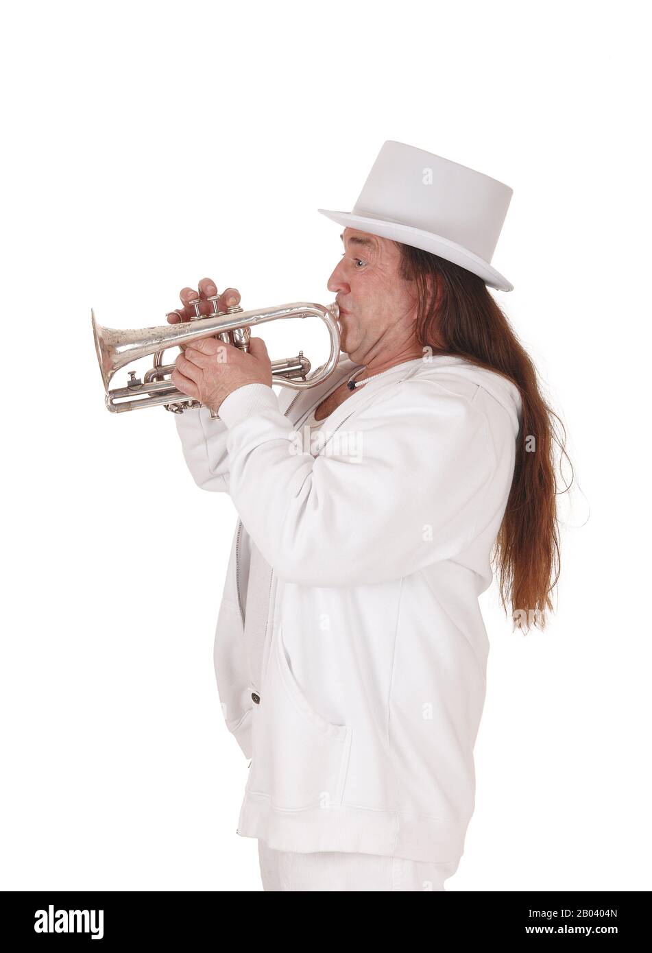 A middle age indigenous man standing in a white outfit and white hat ...