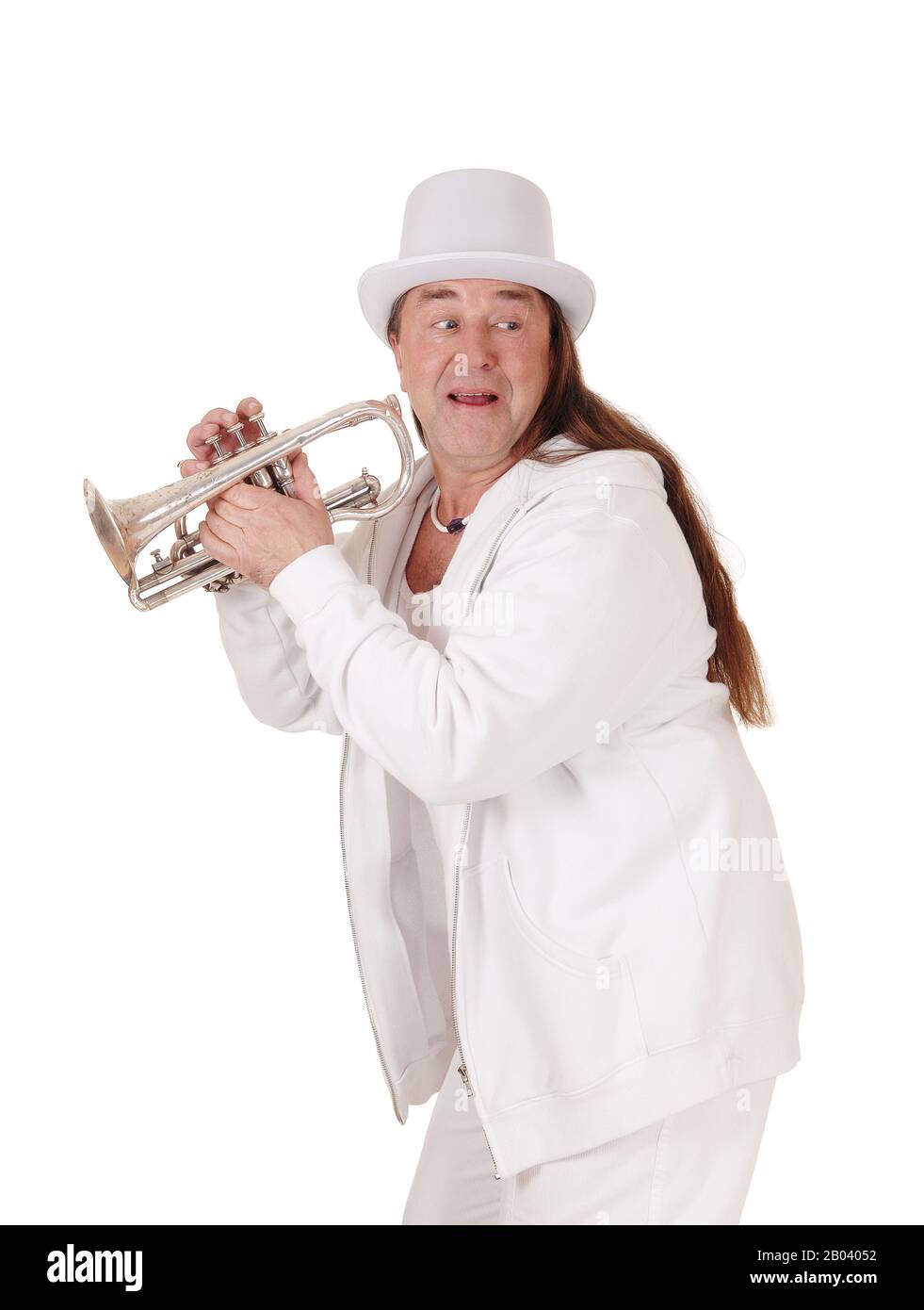 A middle age indigenous man standing in a white outfit and white hat ...