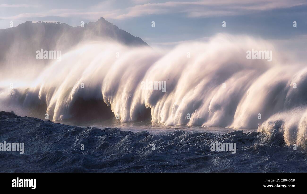 big wave breaking with spray Stock Photo - Alamy