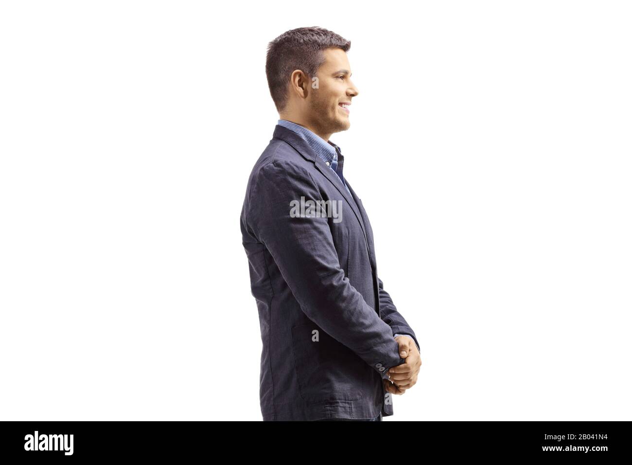 Profile shot of a man standing and smiling isolated on white background ...