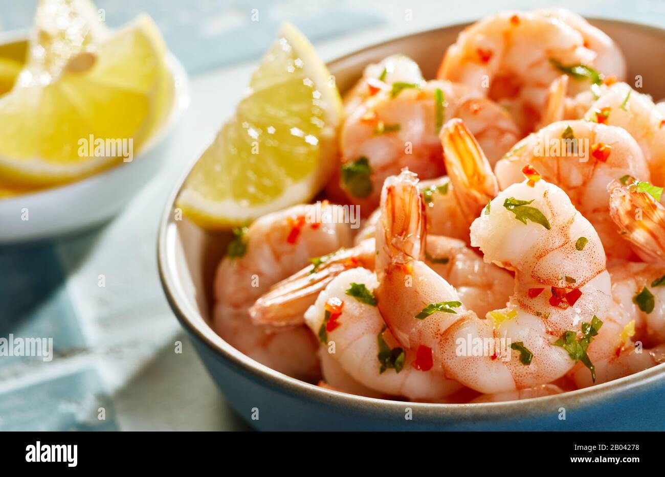Bowl of gourmet Mediterranean scampi appetizer seasoned with herbs and ...