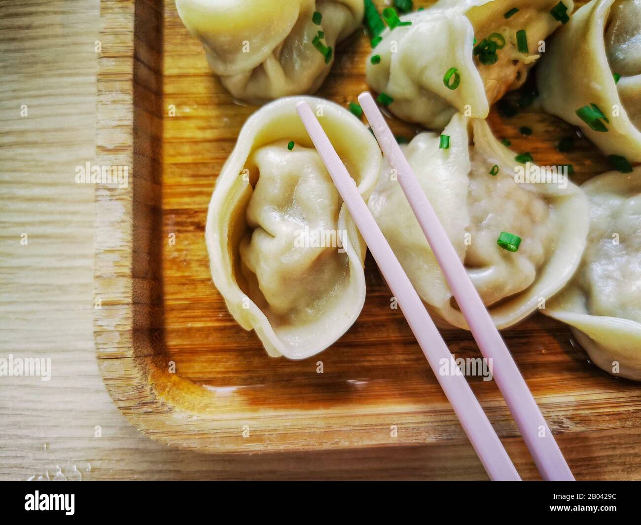 Dim sum aka dumplings, momos with chopsticks Stock Photo - Alamy