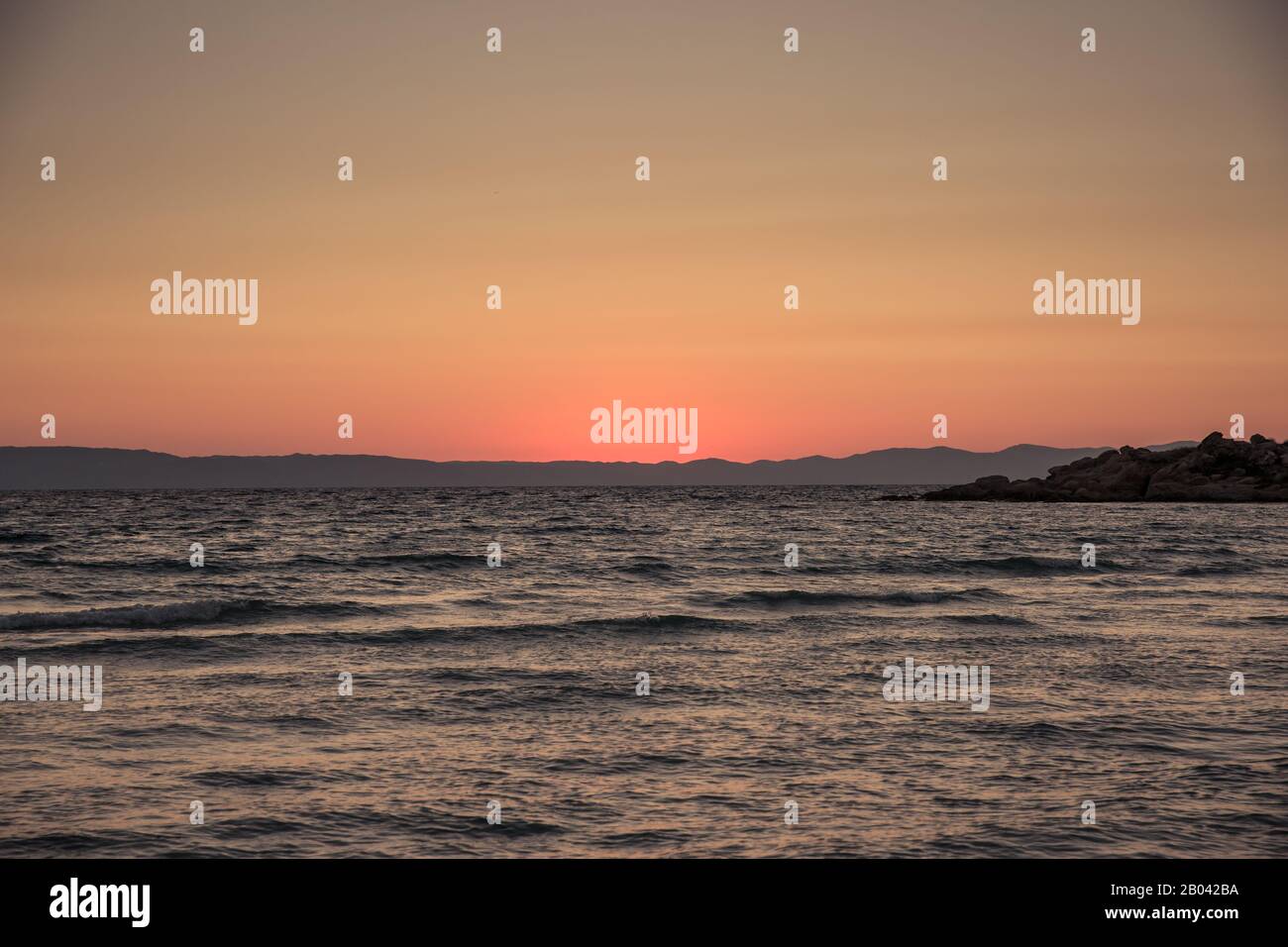 Sun rising over the sea hi-res stock photography and images - Alamy