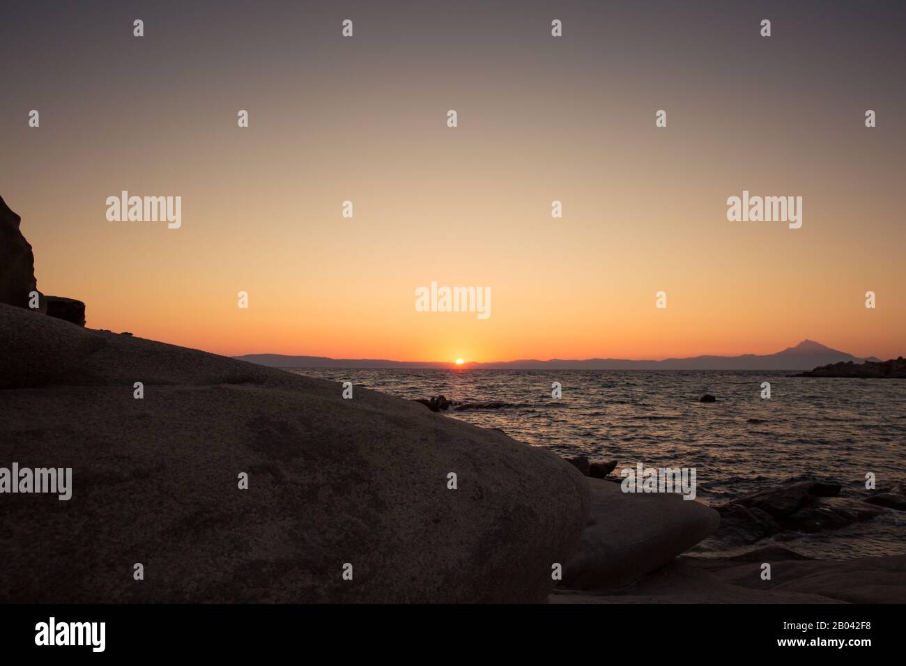 Sunrise over beach people hi-res stock photography and images - Alamy