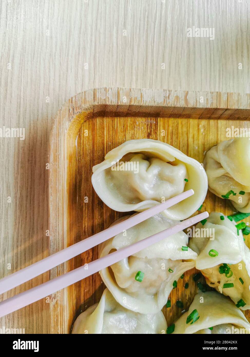 Dim sum aka dumplings, momos with chopsticks Stock Photo - Alamy