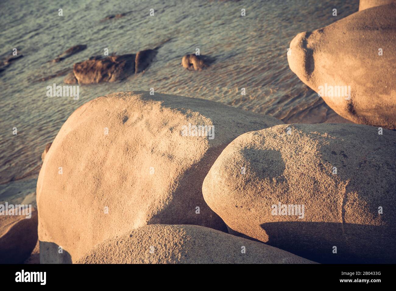 Huge stone and the sea behind / Beautiful rocky shore in Greece while ...