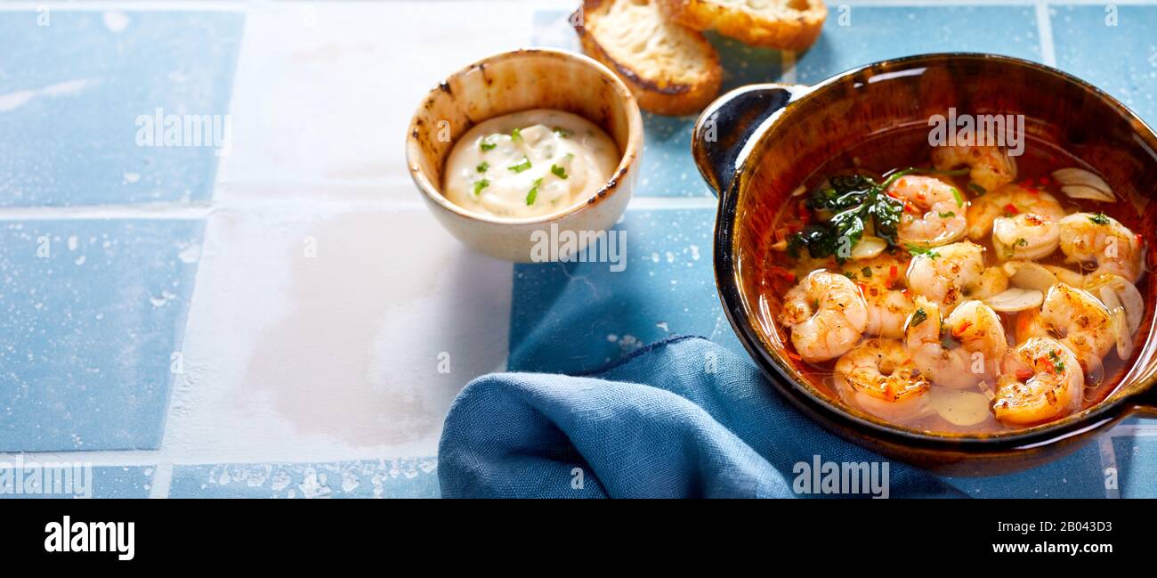 Bowl of fresh spicy mediterranean scampi or lobster served with a ...