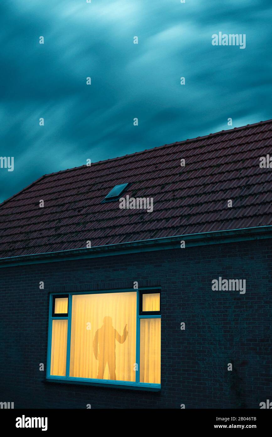 Night illuminated windows man home hi-res stock photography and images ...