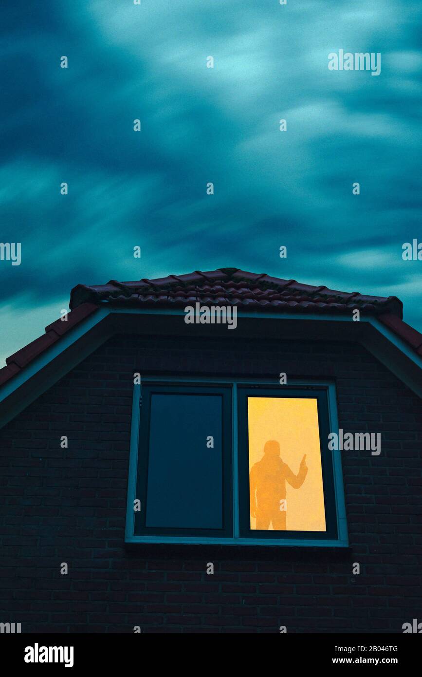 Night illuminated windows man home hi-res stock photography and images ...
