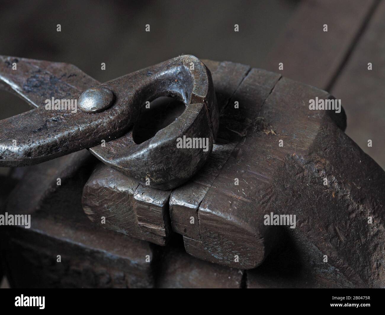 Old metal wire cutters lie on a rusty vise. The concept of working ...