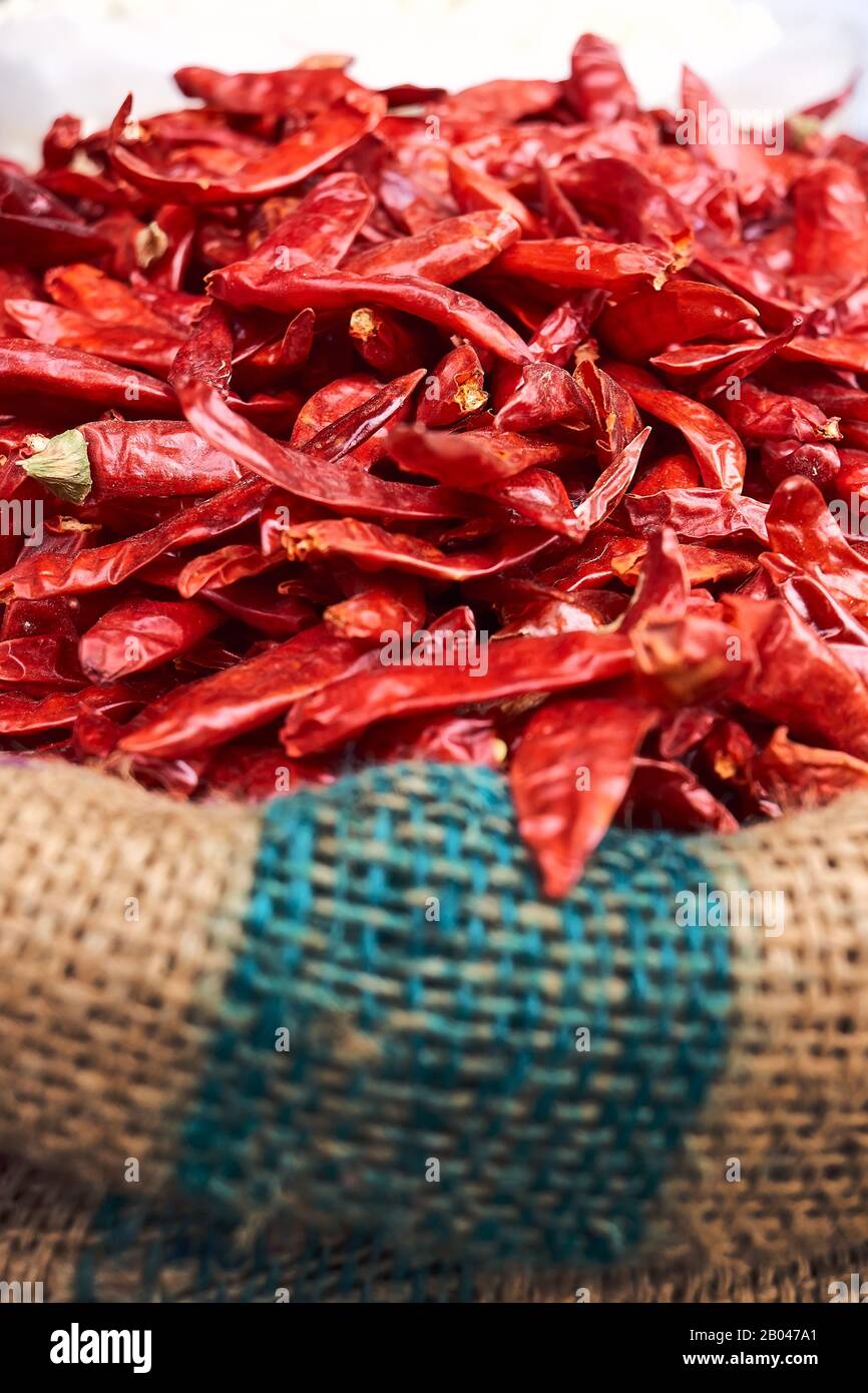 Red peppers in a canvas bag at a street market in India Stock Photo - Alamy
