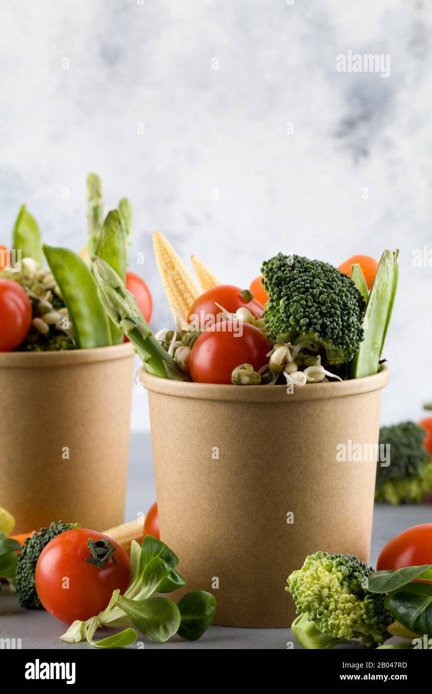 Healthy food in disposable eco friendly food packaging. Vegetables in ...