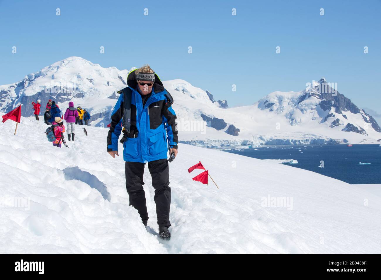 Tourists from an expedition cruise ship at Orne harbour on the Danco ...