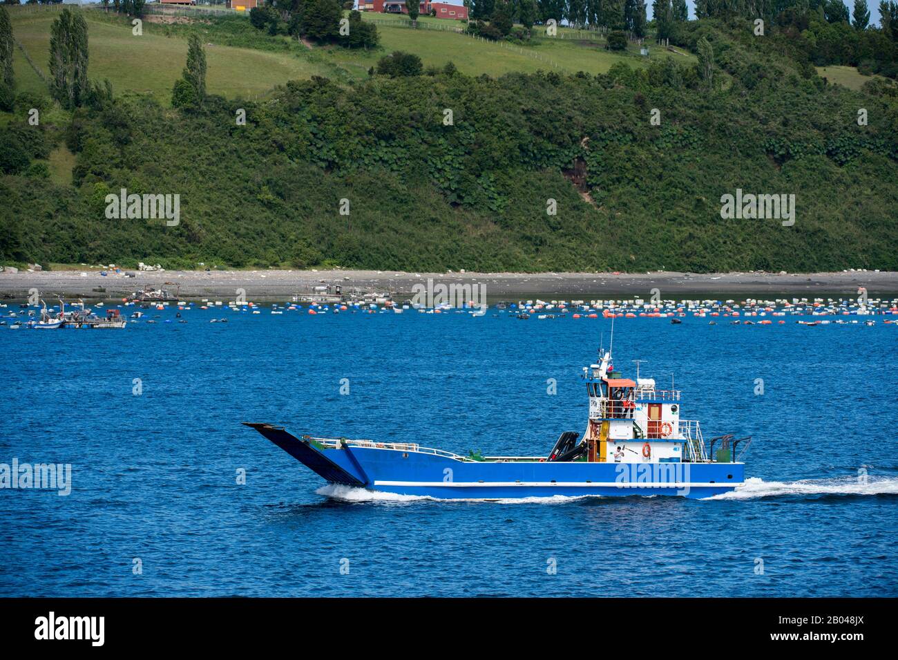 Boat supplying and working for the fish farms near Chiloe Island in ...