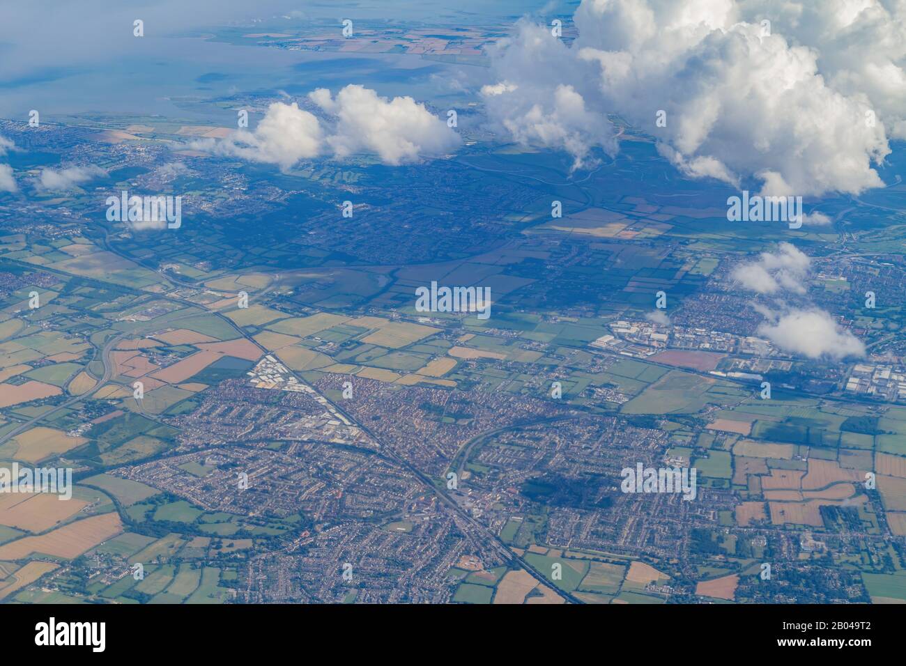 Aerial sunny view of rural landscape of UK from a window seat in an ...