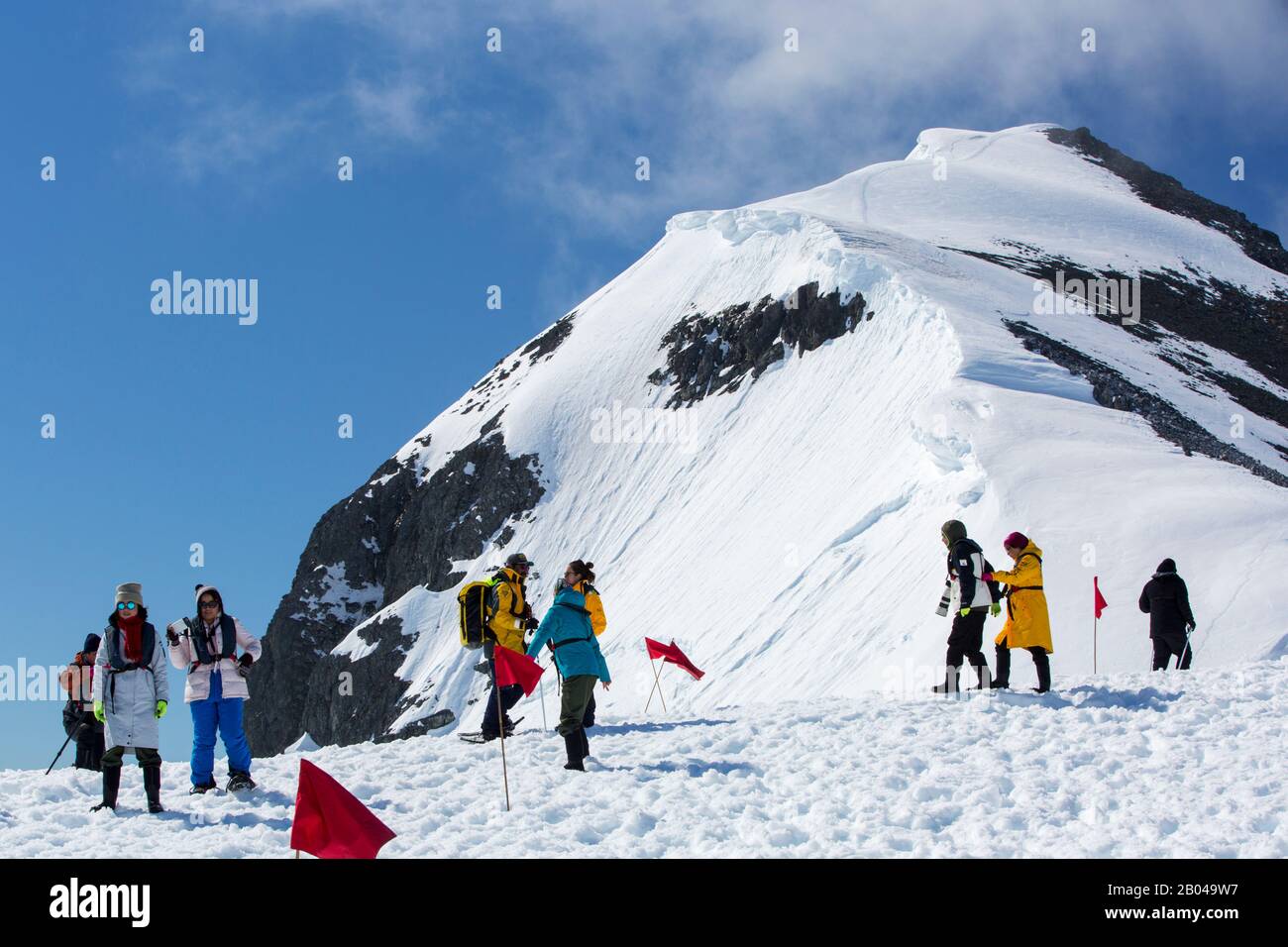 Tourists from an expedition cruise ship at Orne harbour on the Danco ...
