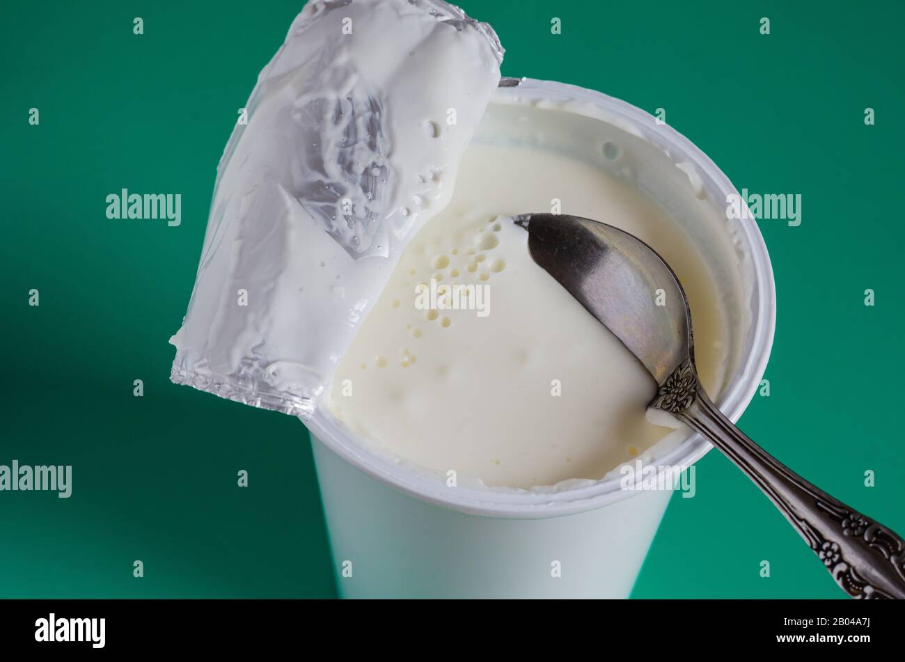 Delicate smooth surface of yogurt in a glass. Healthy eating Selective ...