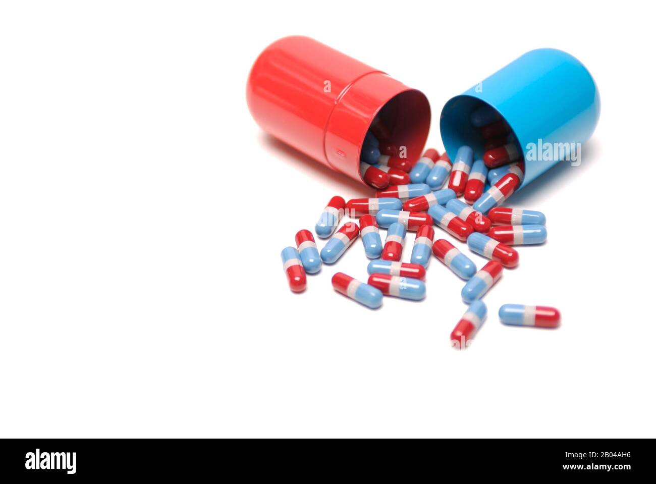 Big pile of red, white, and blue medicine pills spilling out of a ...