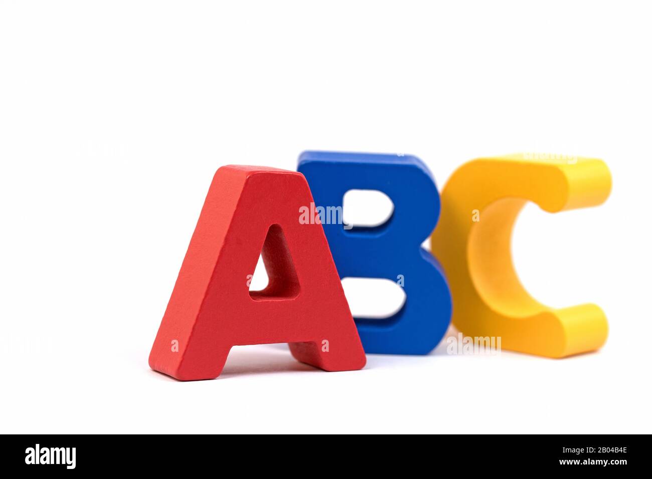 Colorful wooden letters against white background, ABC Stock Photo - Alamy