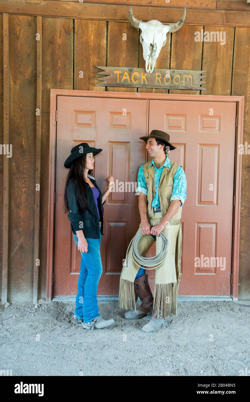 Cowgirl at a barn hi-res stock photography and images - Alamy