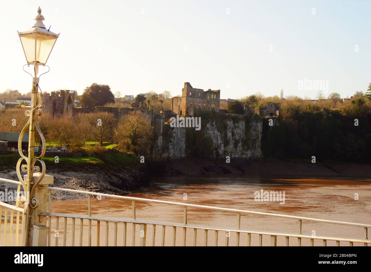 Chepstow Castle viewed from the Old Wye Bridge spanning the River Wye ...