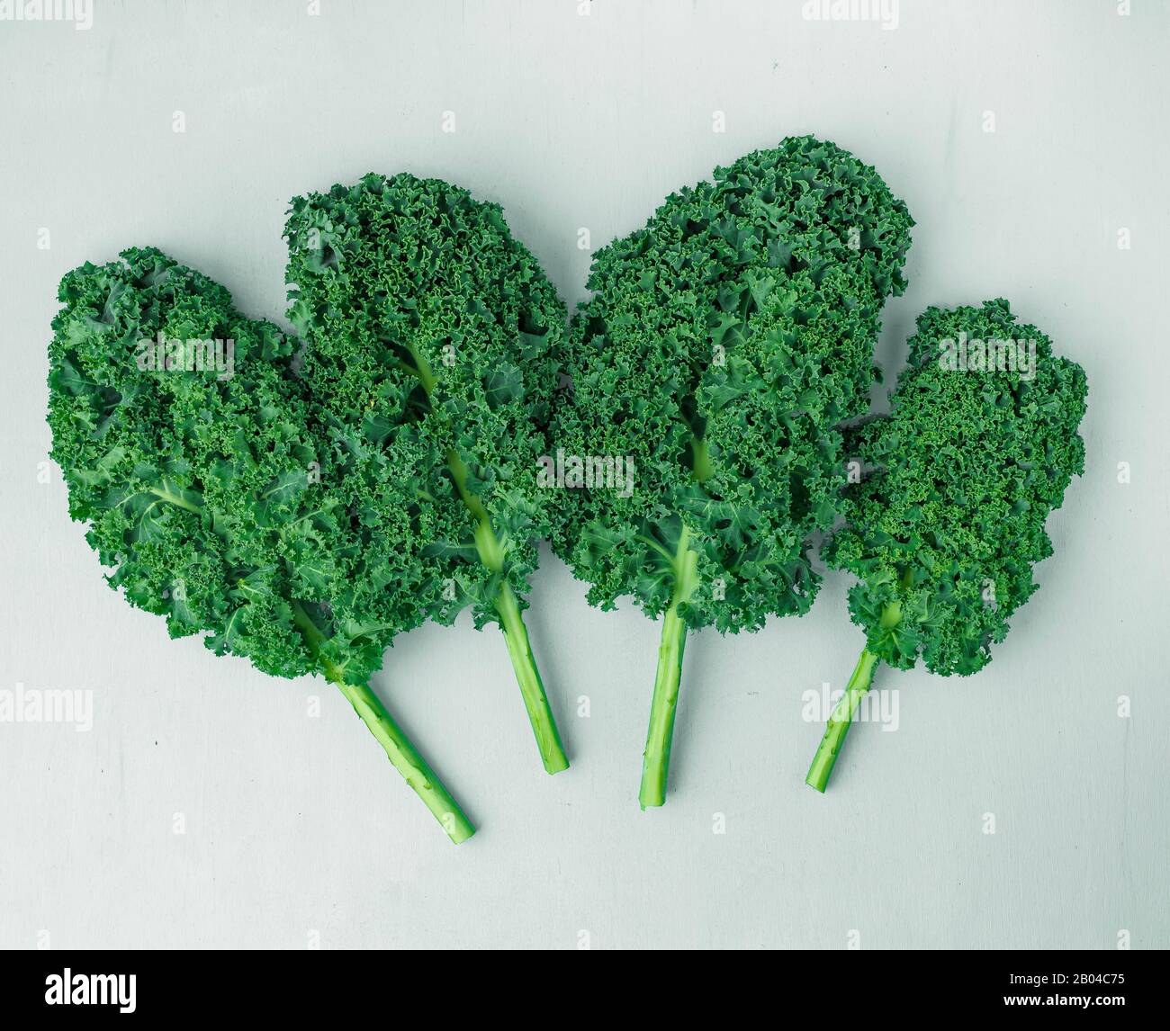 Kale leaves isolated on white background Stock Photo - Alamy