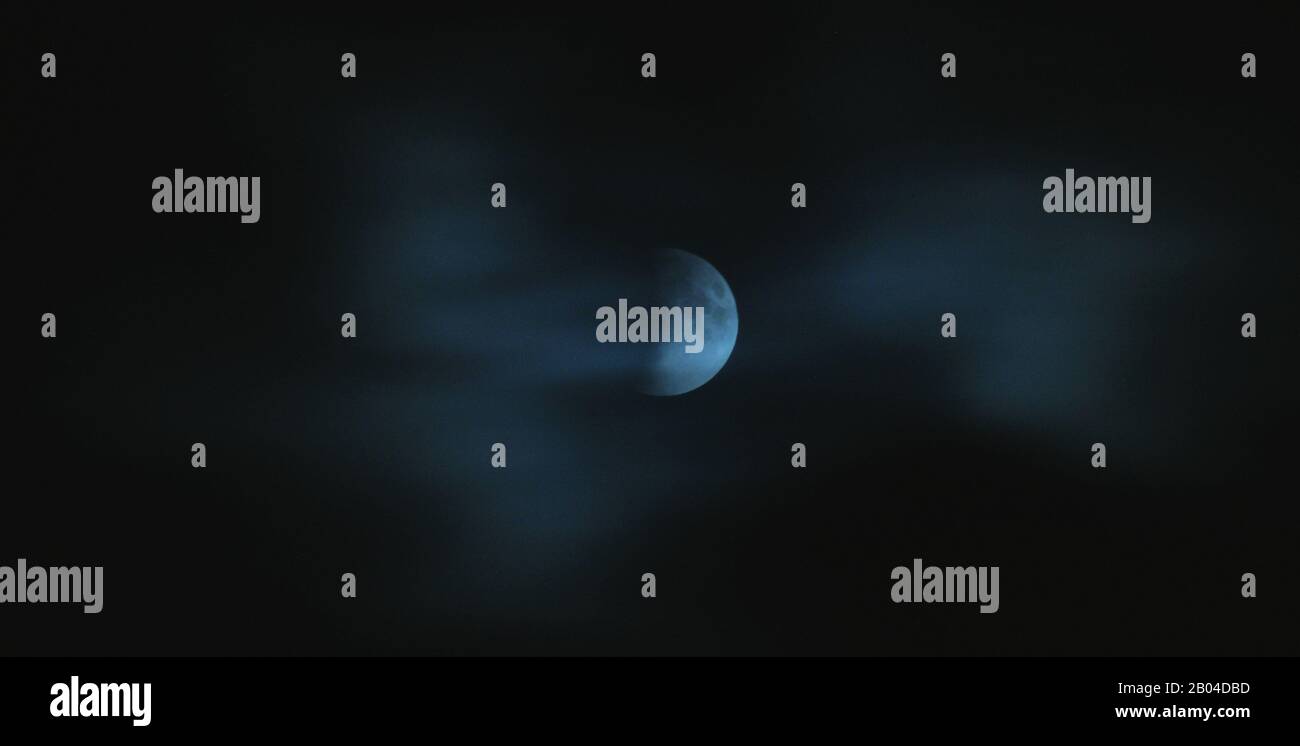 Long Exposure Cloudy Moon Stock Photo - Alamy