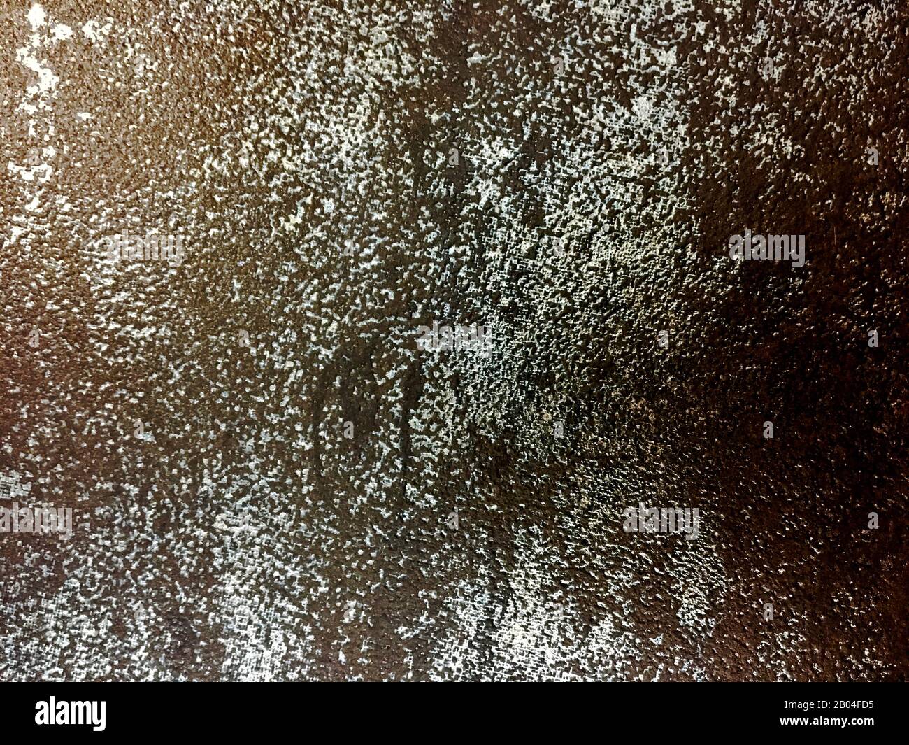 Plaster with the effect of rust and irregularities on the wall in brown ...