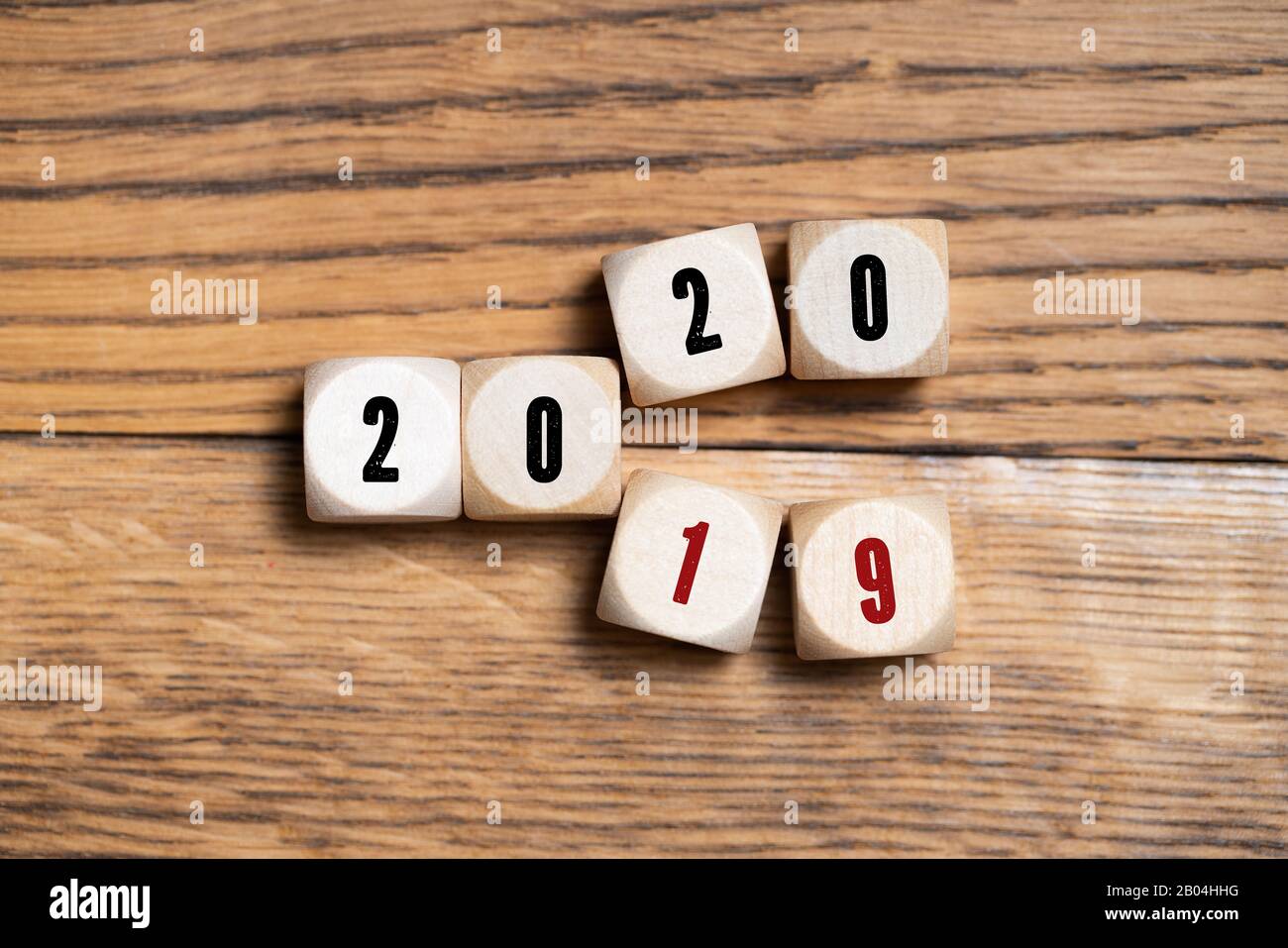 cubes with numbers visualizing the change from 2019 to 2020 on wooden ...