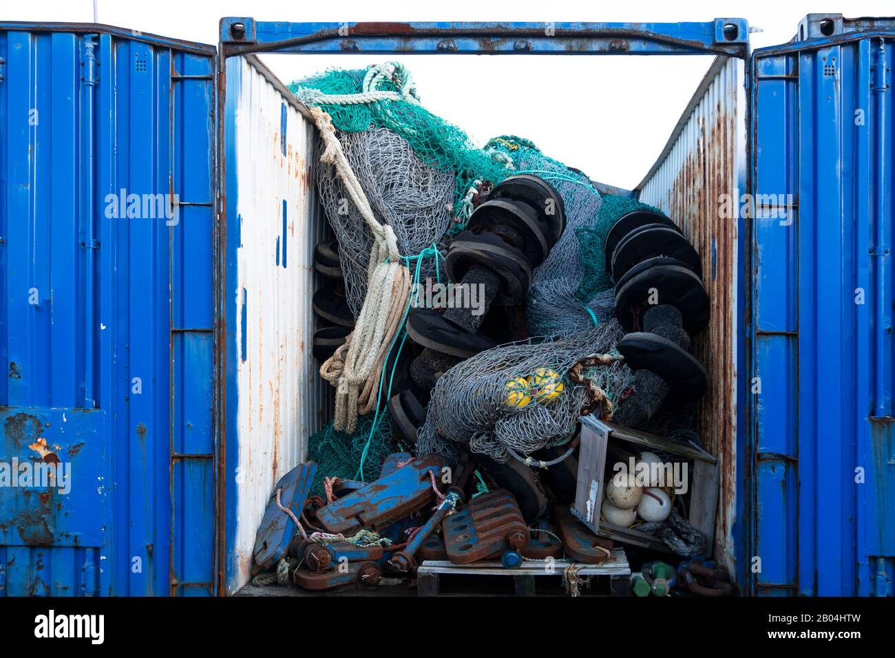 old discarded Fishing nets rope and buoys in shipping Container Stock ...