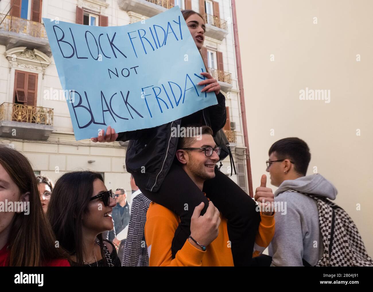 Young girl protests against climate change by showing a sign with ...