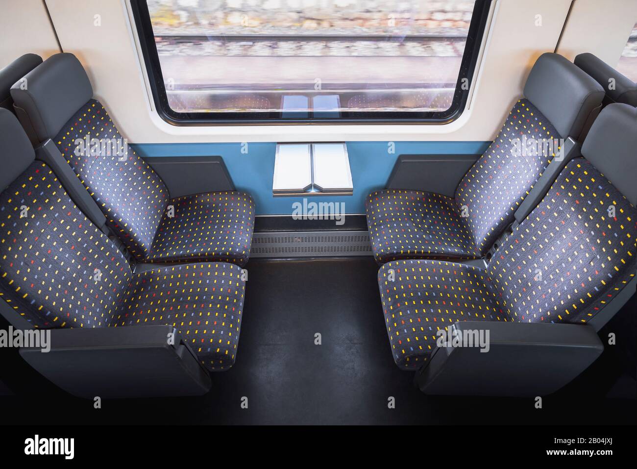 Train chairs inside swiss border train with railway tracks view on ...