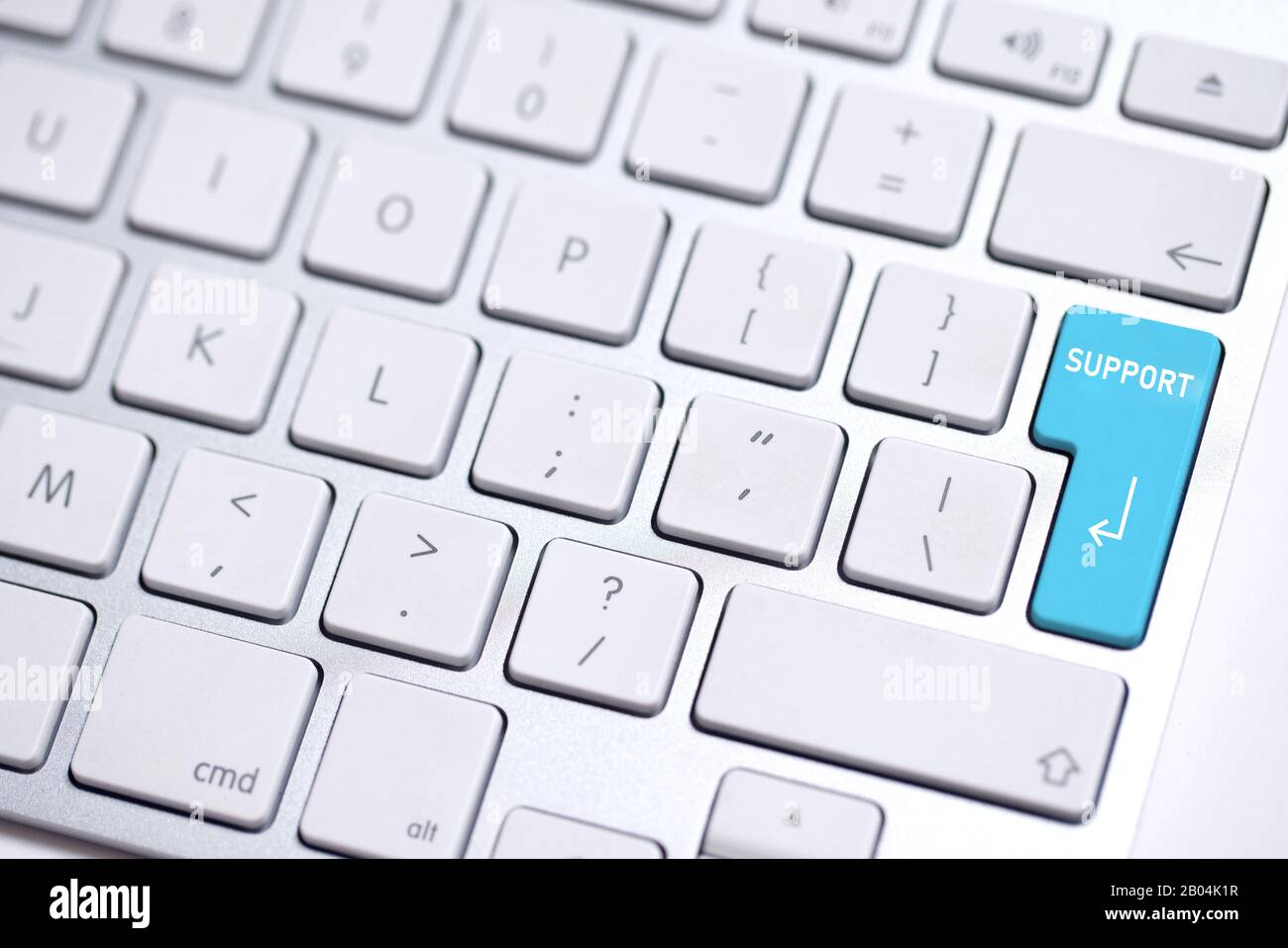 keyboard with light blue colored enter key and the word "support" on it ...