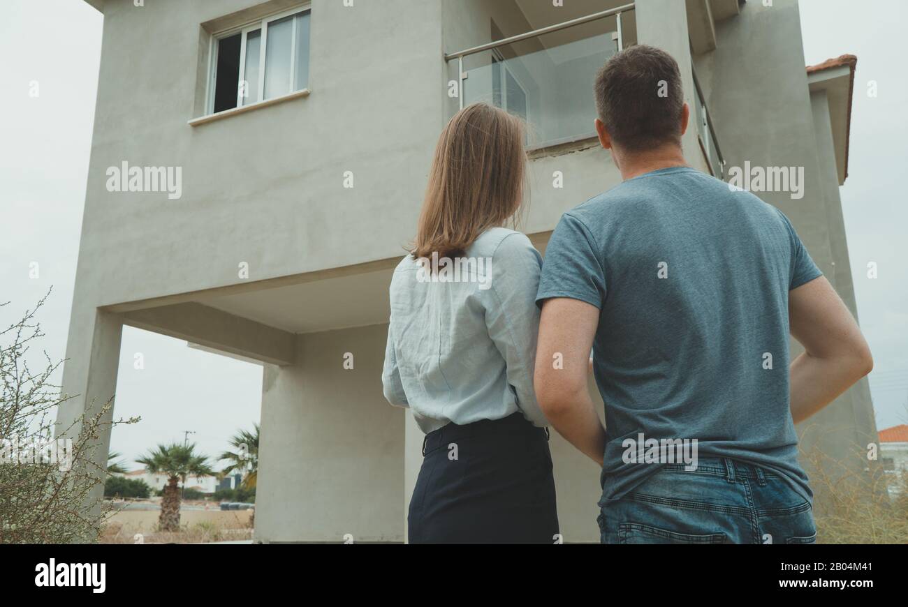 Real estate agent shows the development to his client Stock Photo - Alamy