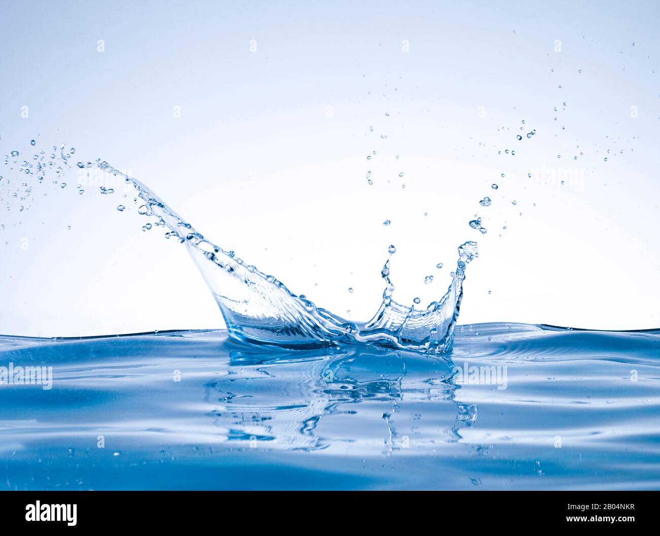 blue water splash crown shape on water surface isolated on white ...
