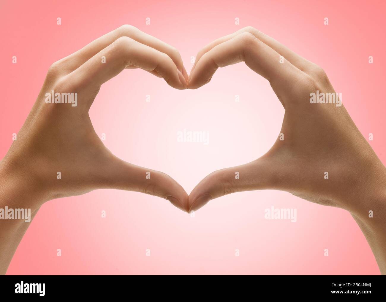 female hands form heart shape gesture isolated on empty background ...